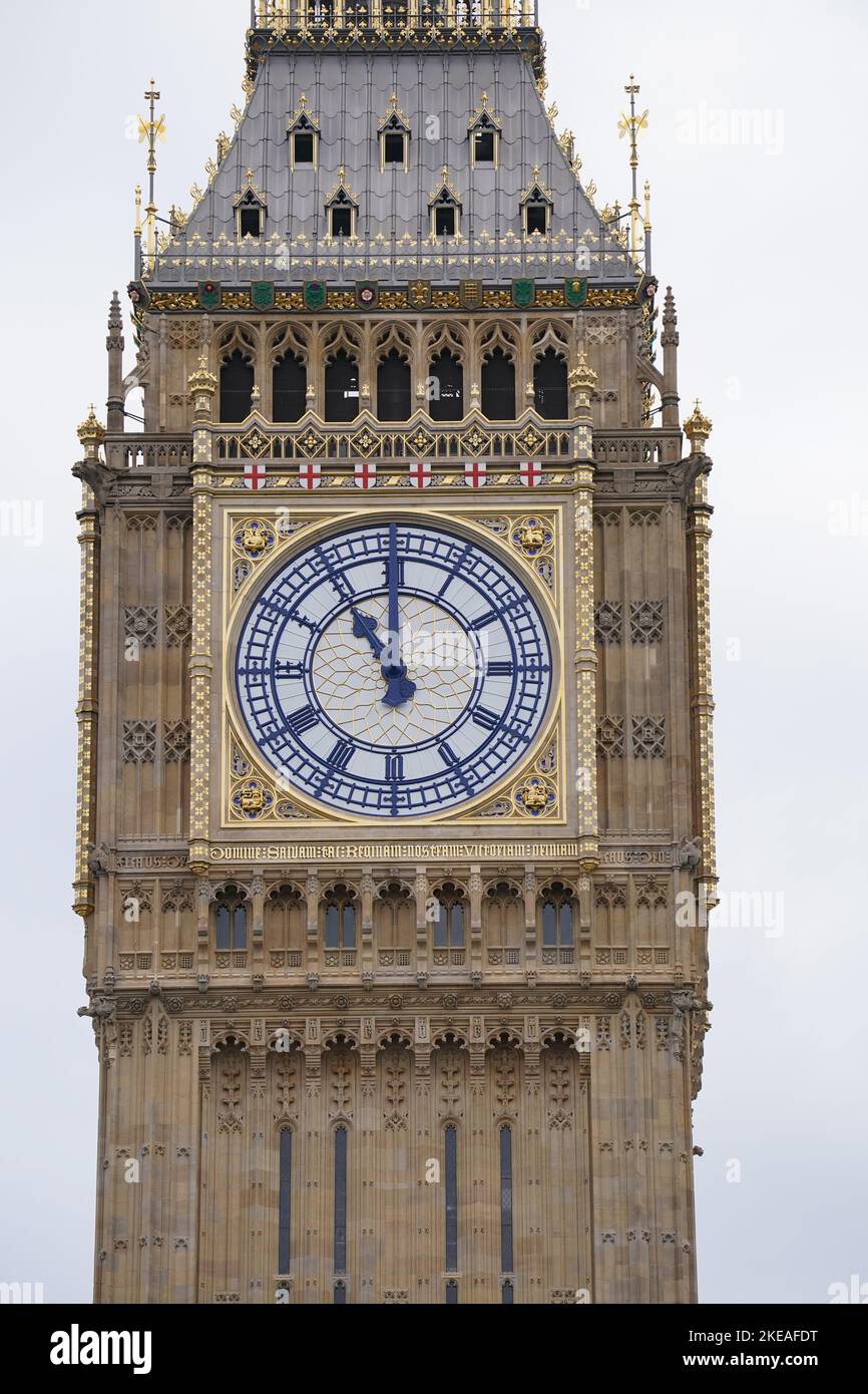 The clock face on Elizabeth Tower shows 11 o'clock as members of the ...