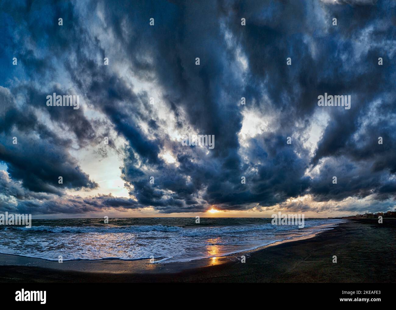 Fantastic stormy sky and dramatic weather panoramic view over the beach ...