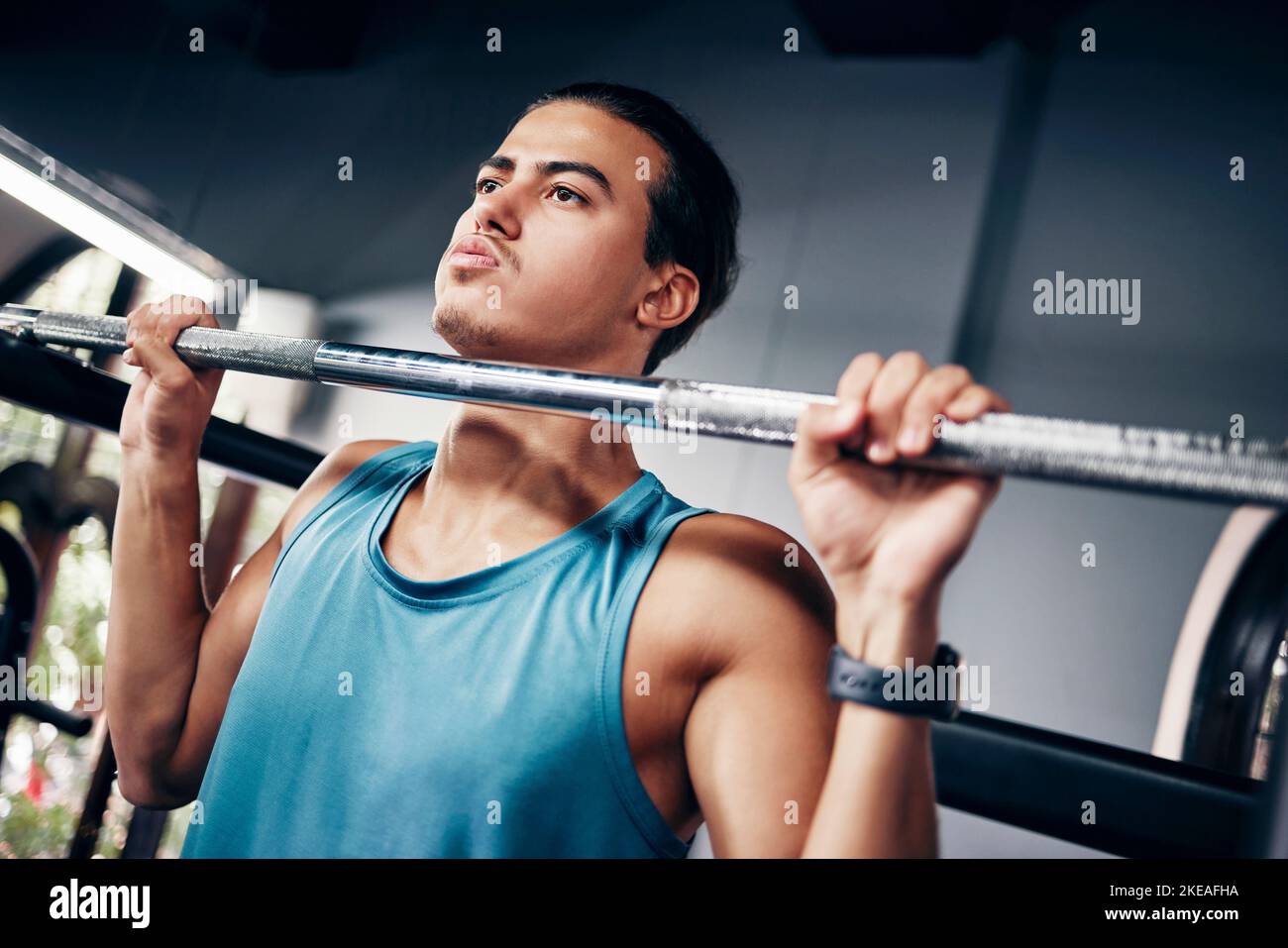 Fitness, man and weightlifting barbell at the gym for heavy workout ...