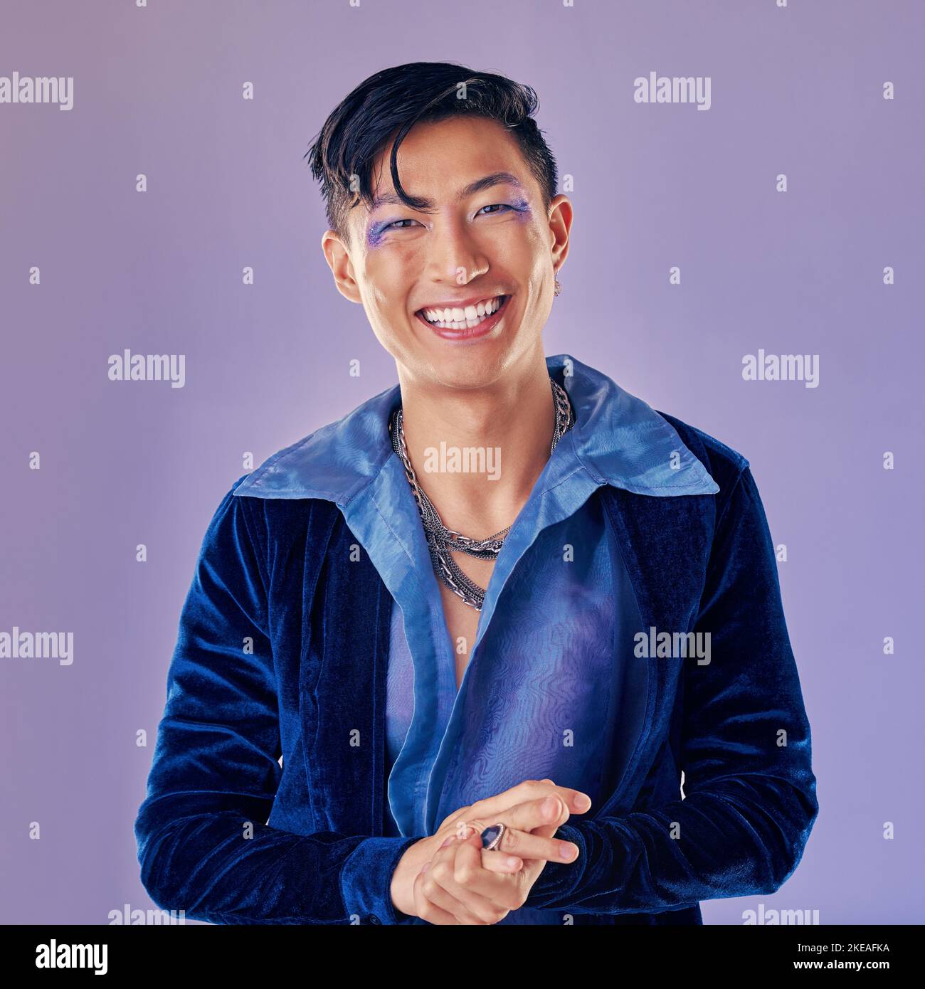 Fashion, punk makeup and Asian man in studio isolated on a purple ... Fashion, punk makeup and Asian man in studio isolated on a purple ...