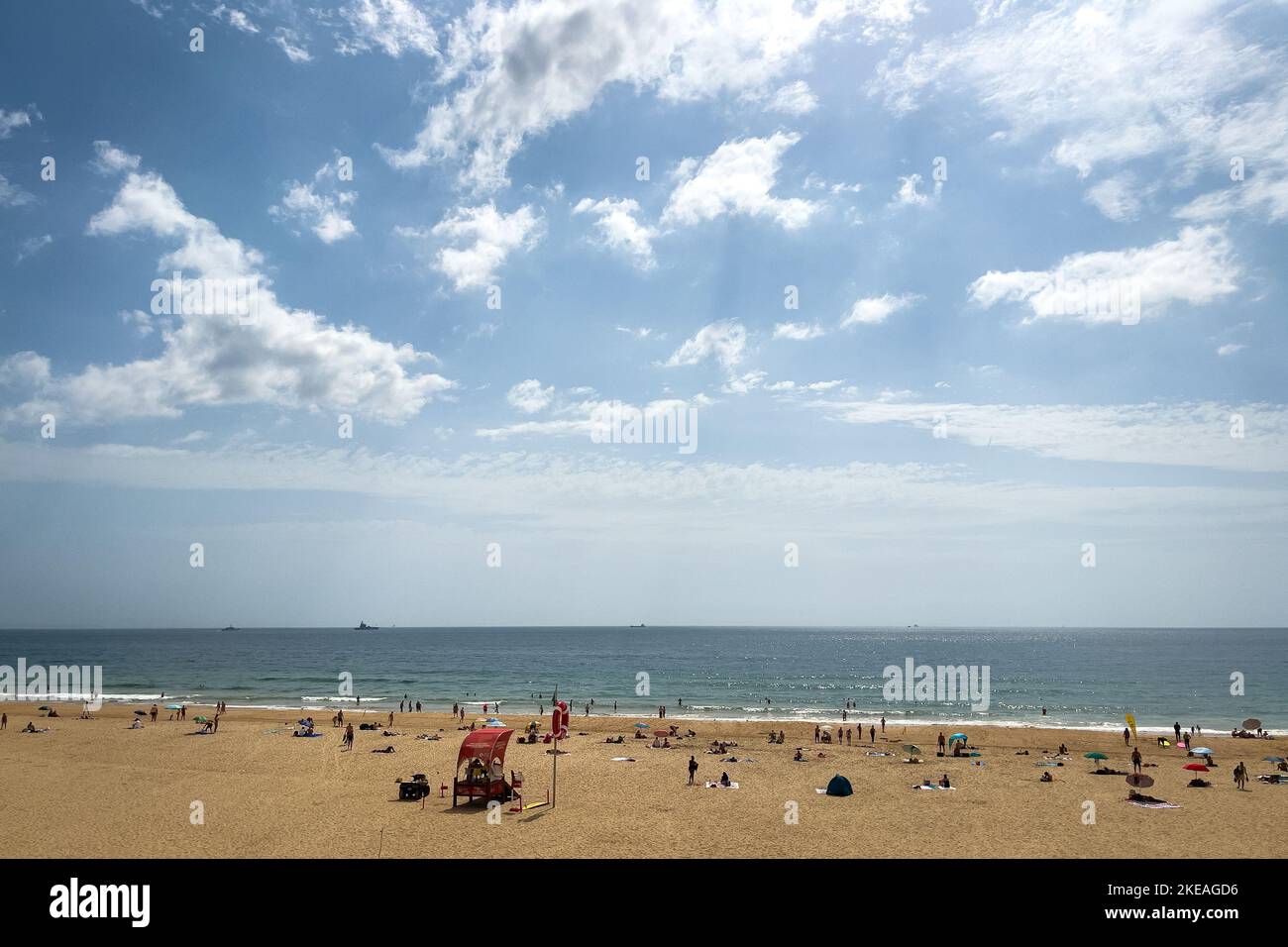 People enjoying their time on the beach in Carcavelos Stock Photo - Alamy