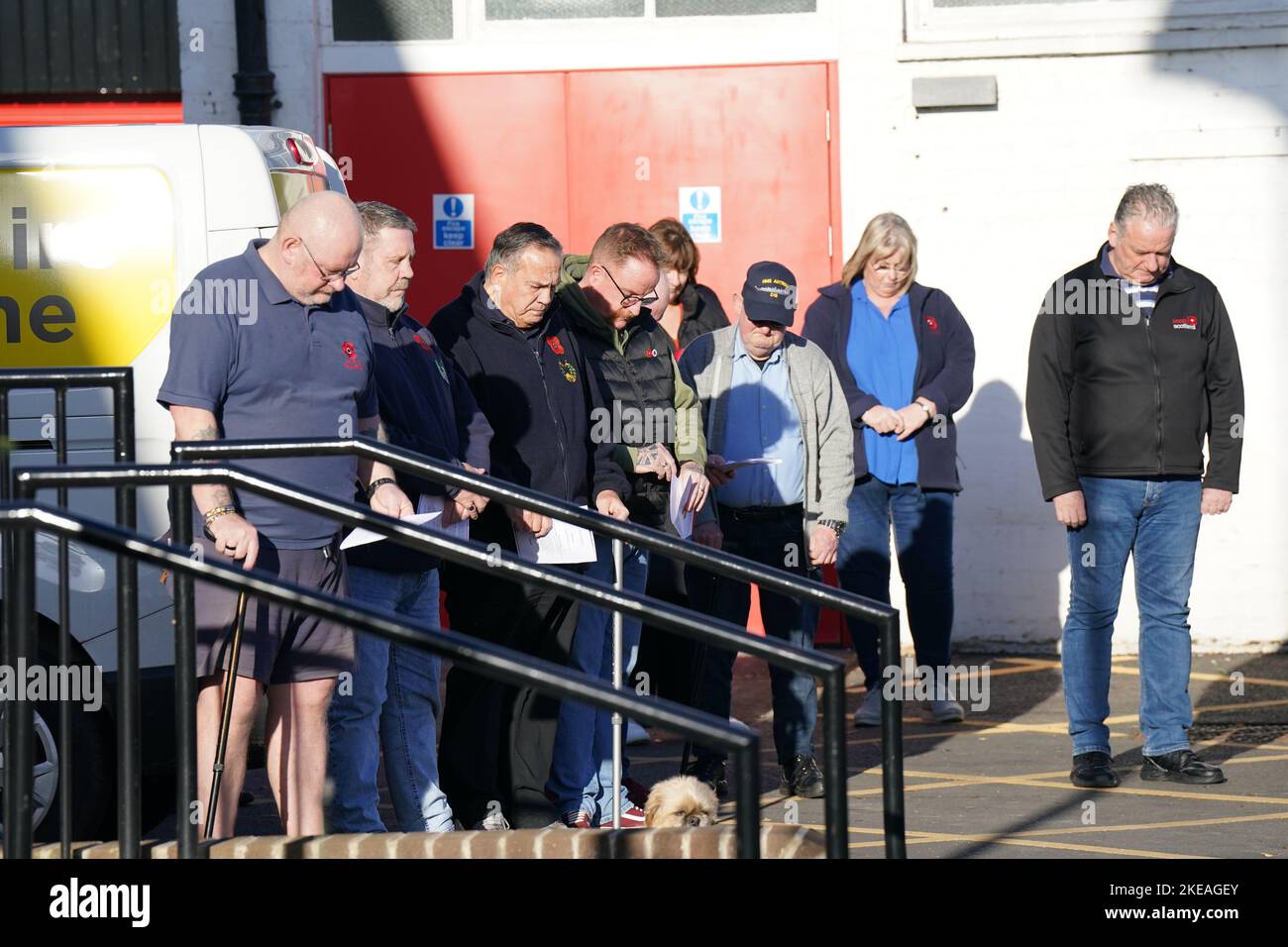 Armed forces veterans and poppy fcatory workers observe a two minute ...