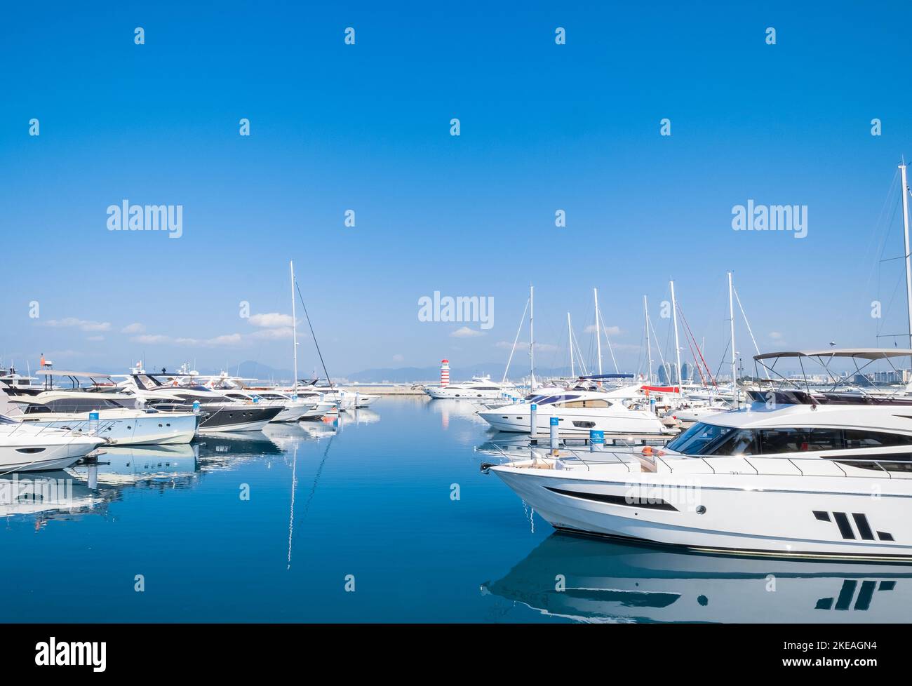 Boats parked in a blue sea under a clear sky Stock Photo - Alamy