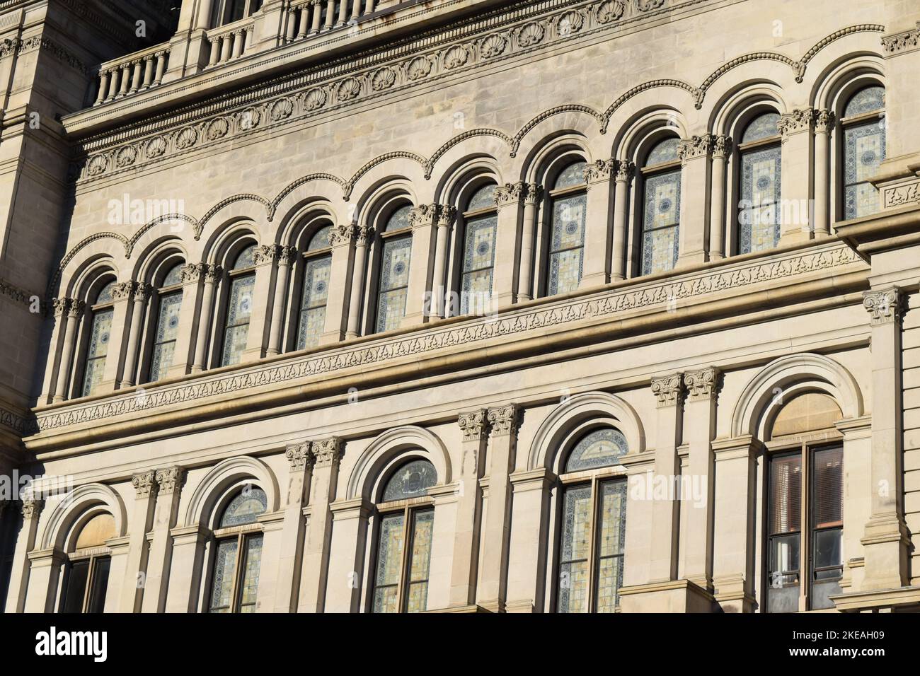 A beautiful shot of a medieval building facade decorated with Ionic ...