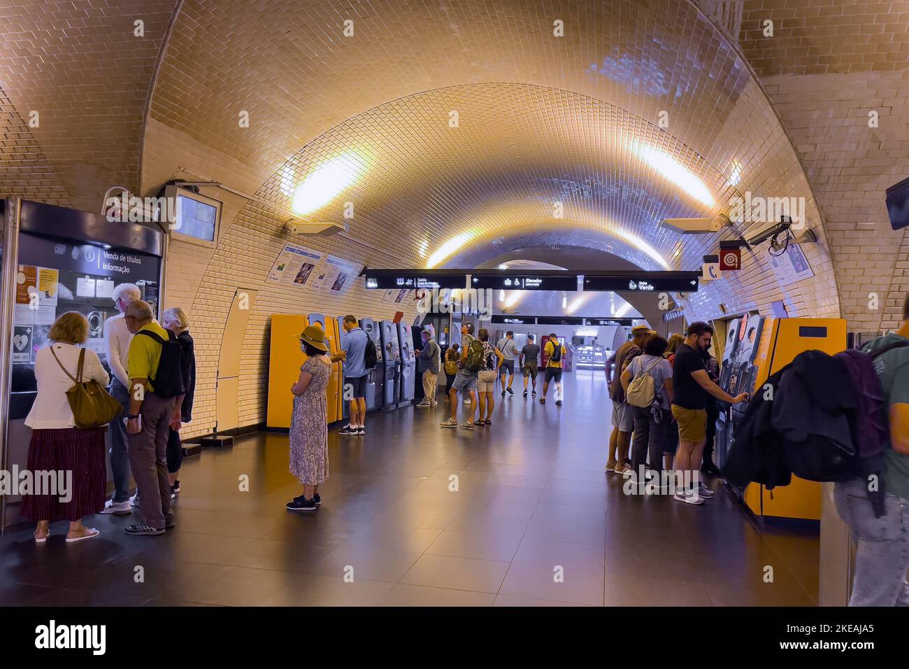 Group of passengers waiting in front of vending machines to get their ...