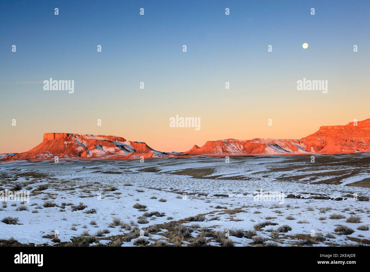 Sandstone monolith at sunrise with full moon, USA, Utah, Grand ...