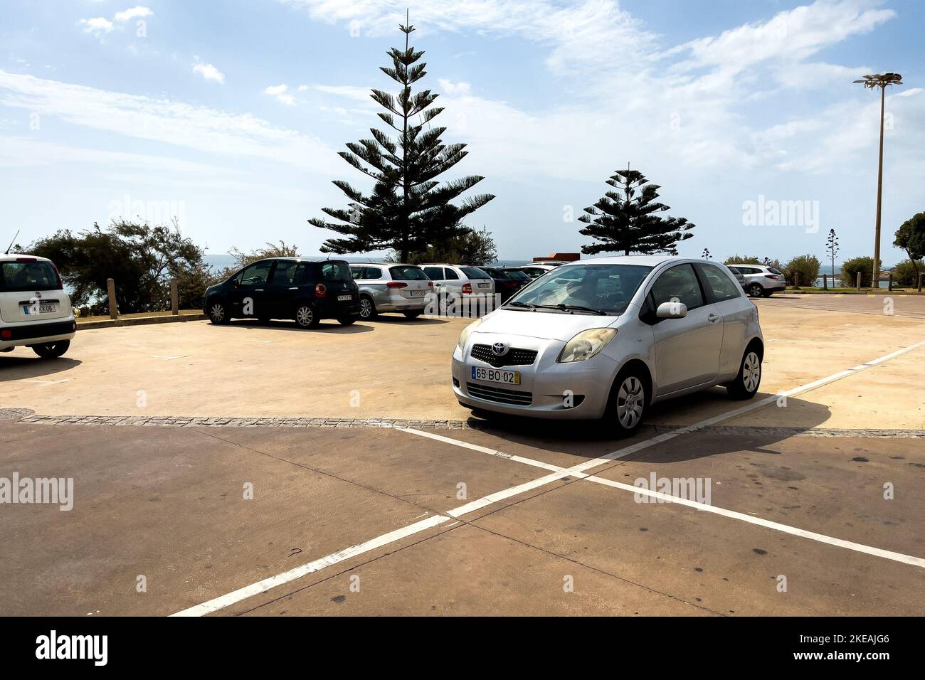 Cars parked on an outdoor parking lot Stock Photo - Alamy