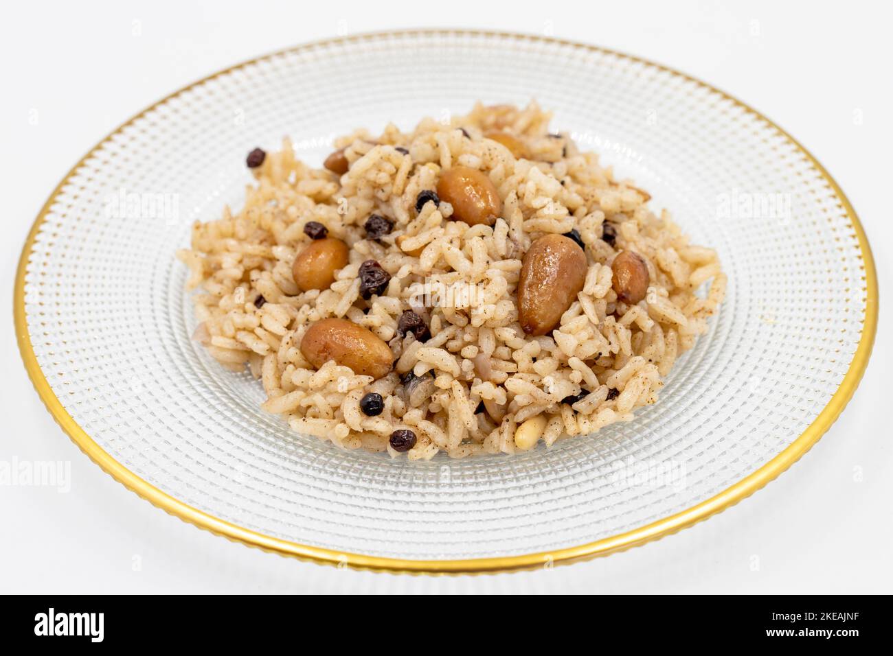 Rice with currants and almonds on a white background. Traditional ...
