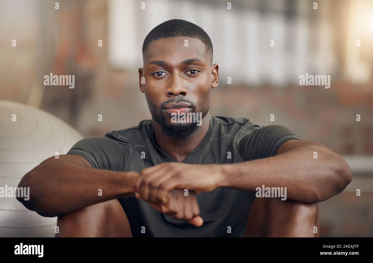 Black man, fitness and exercise in gym, break and rest after sports ...