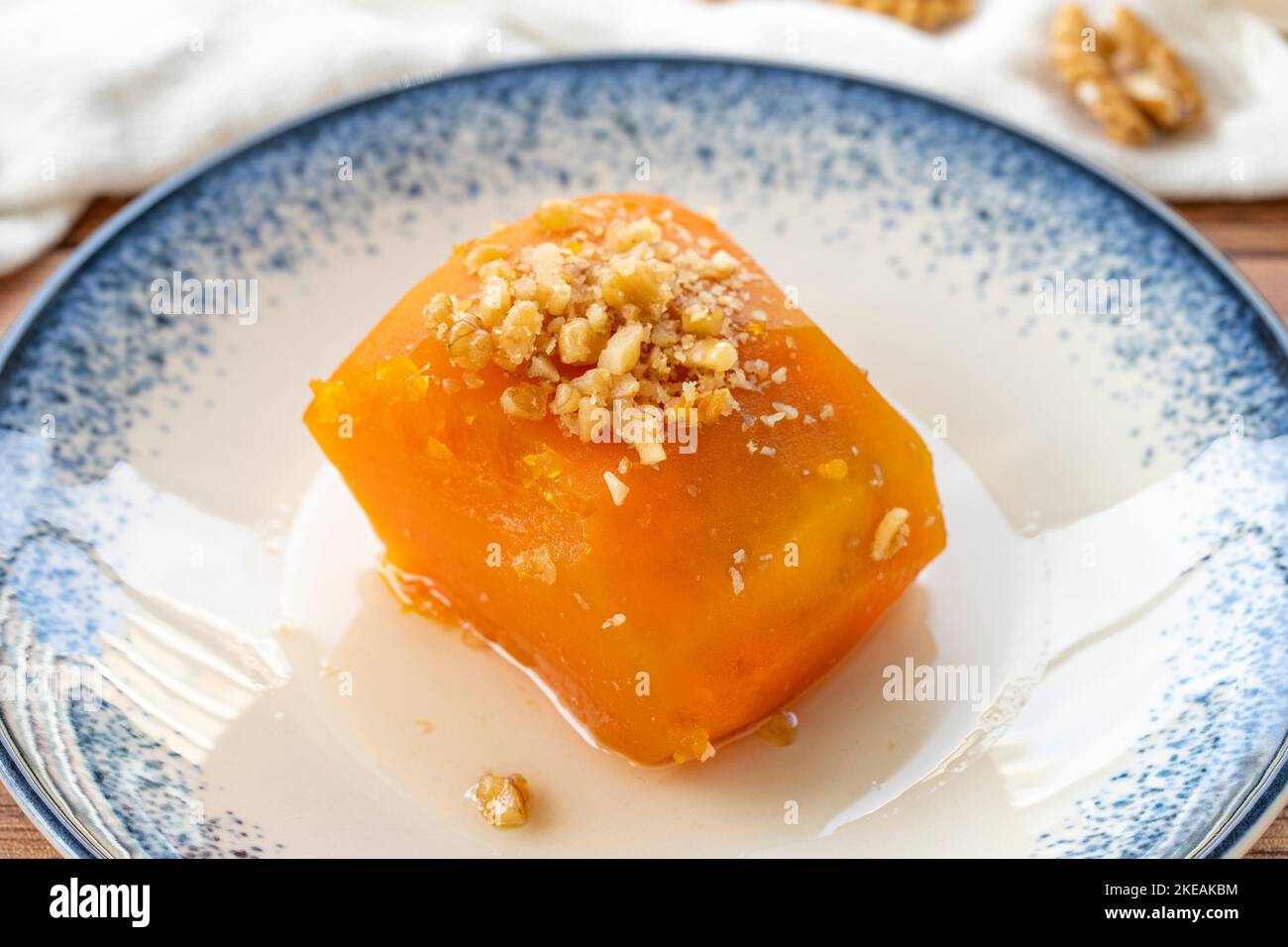 Turkish pumpkin dessert on wood floor. Traditional Turkish cuisine ...