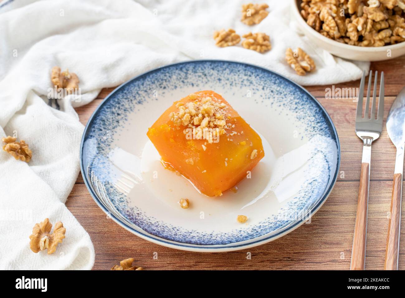 Turkish pumpkin dessert on wood floor. Traditional Turkish cuisine ...