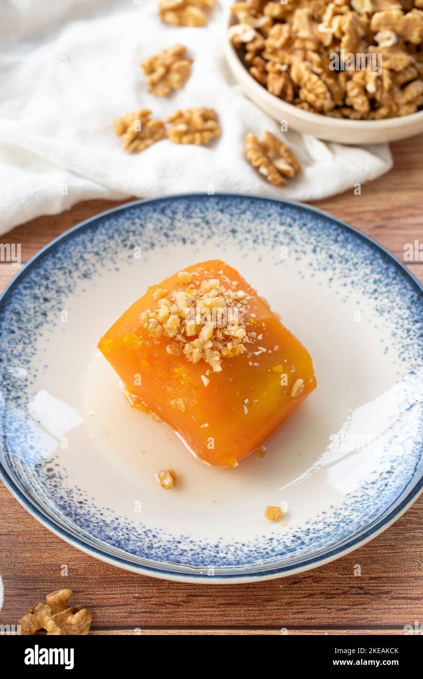 Turkish pumpkin dessert on wood floor. Traditional Turkish cuisine ...