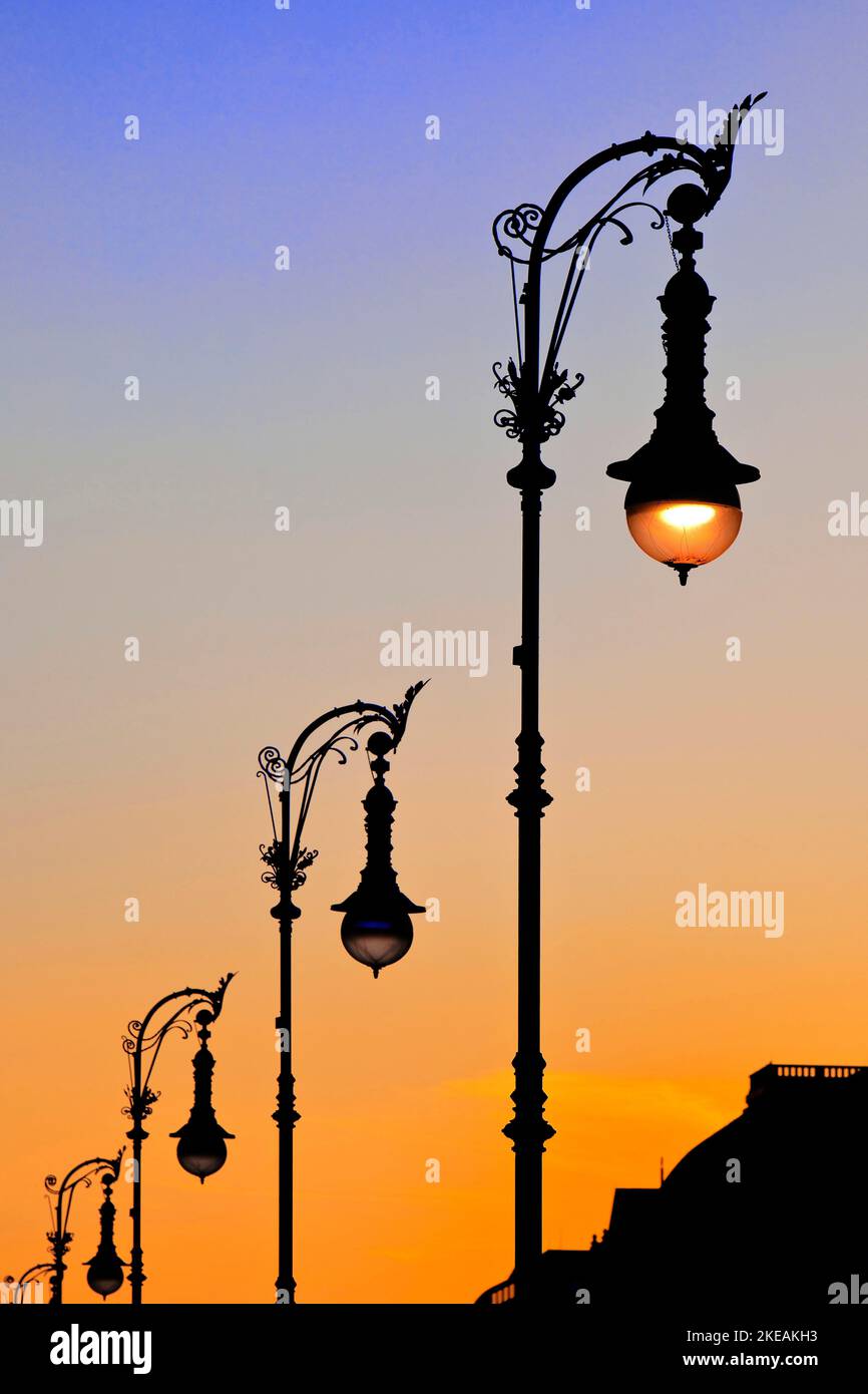 Old Berlin gas lanterns in the street Unter den Linden at sunset at the ...