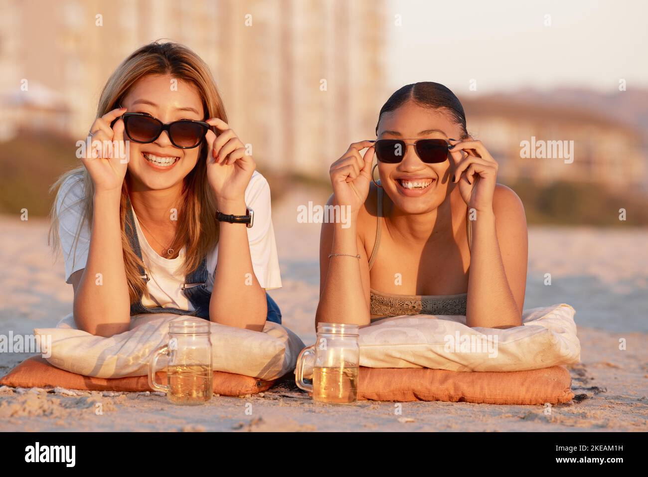Beach, happy and friends relaxing with sunglasses while on a summer ...