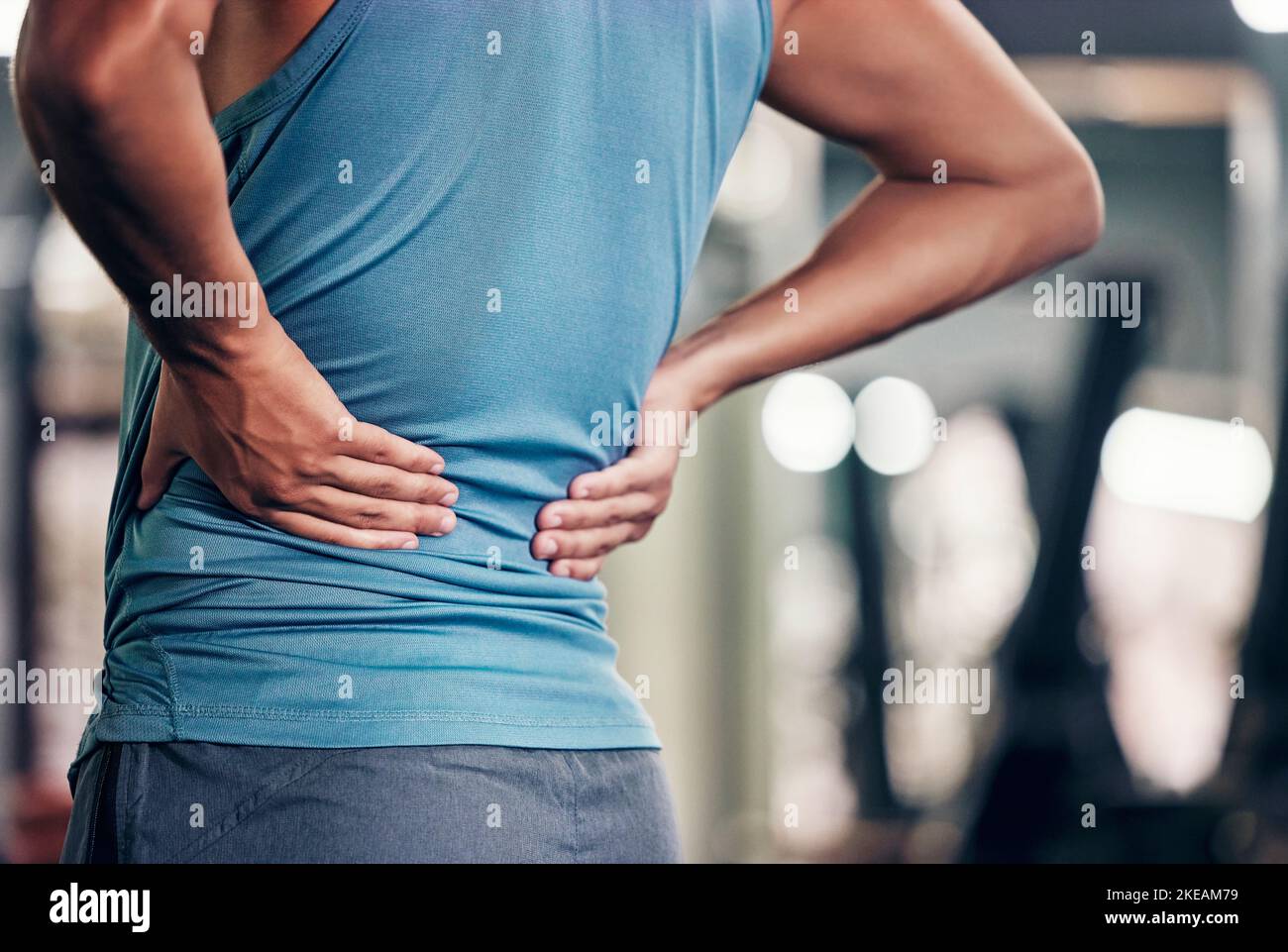 Fitness, back pain and man hands for gym injury, healthcare risk and ...