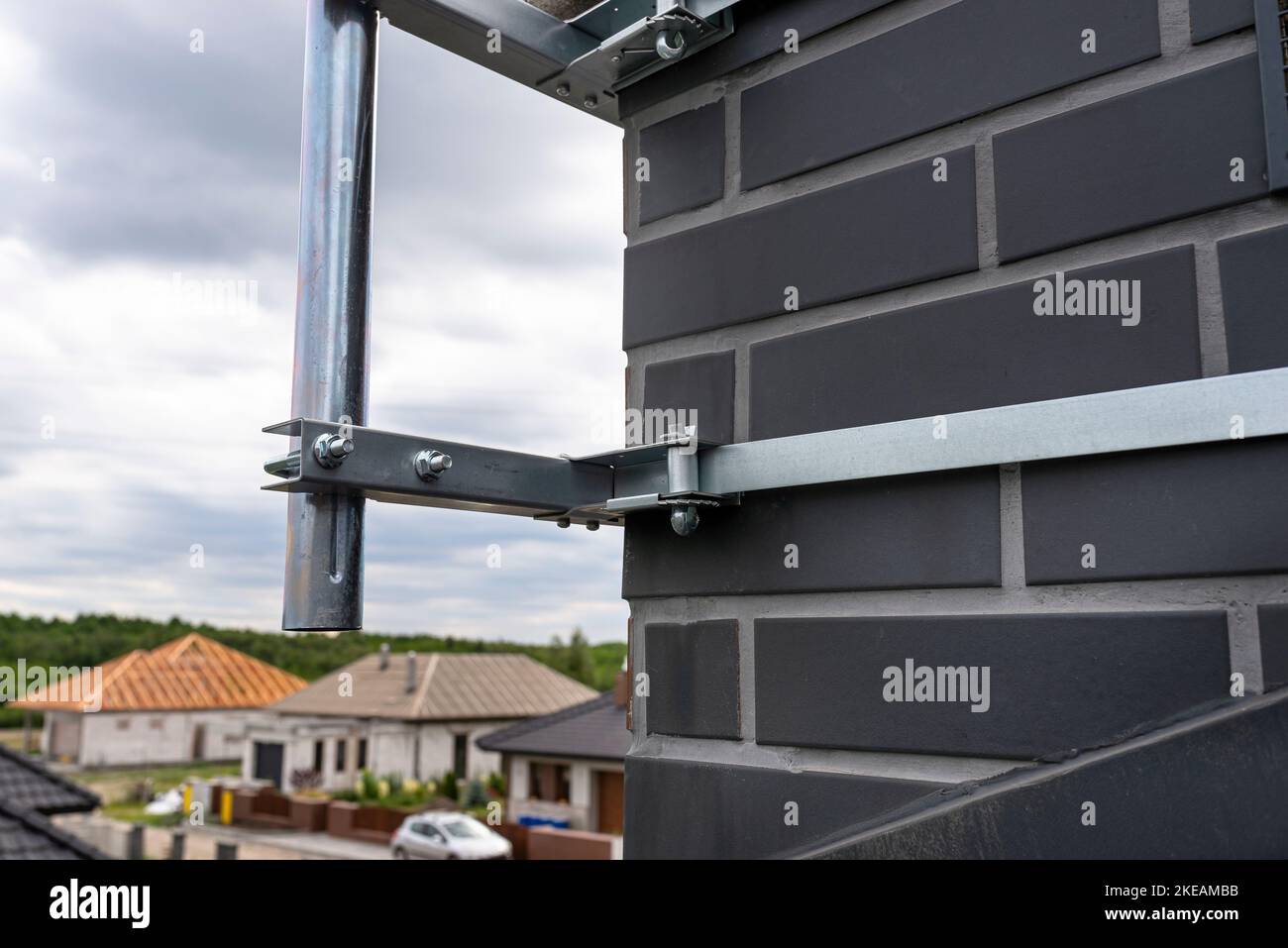 Chimney holder for mounting a satellite dish on the chimney, close-up ...