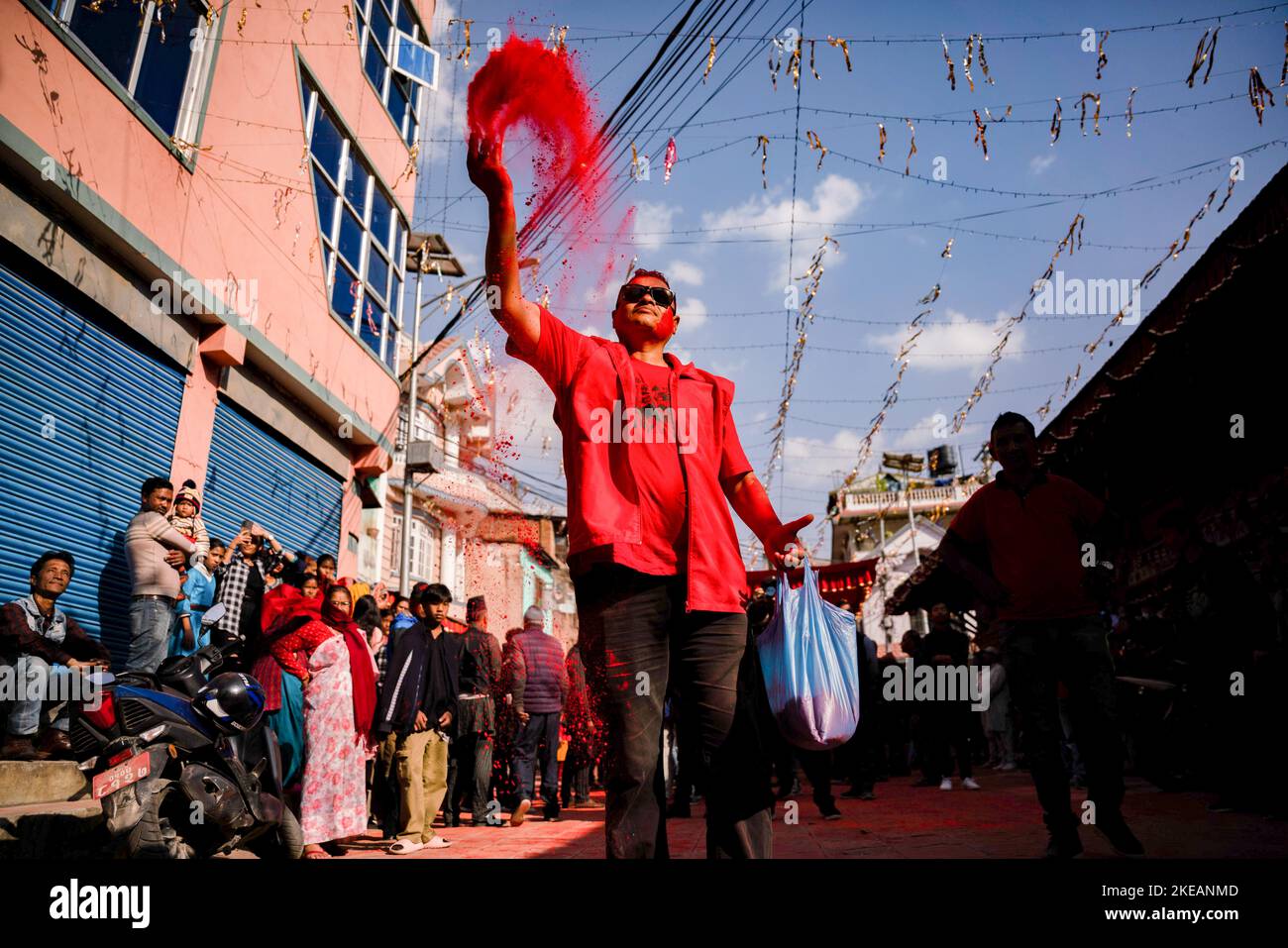 Kathmandu, Nepal. 11th Nov, 2022. A man hurls vermillion colors in the ...
