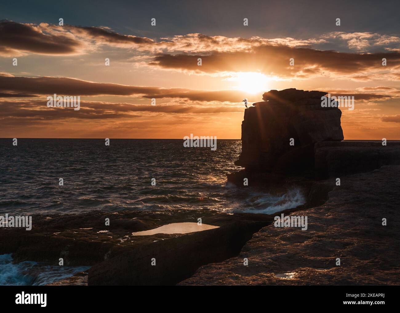 Sunset with rock silhouette hi-res stock photography and images - Alamy