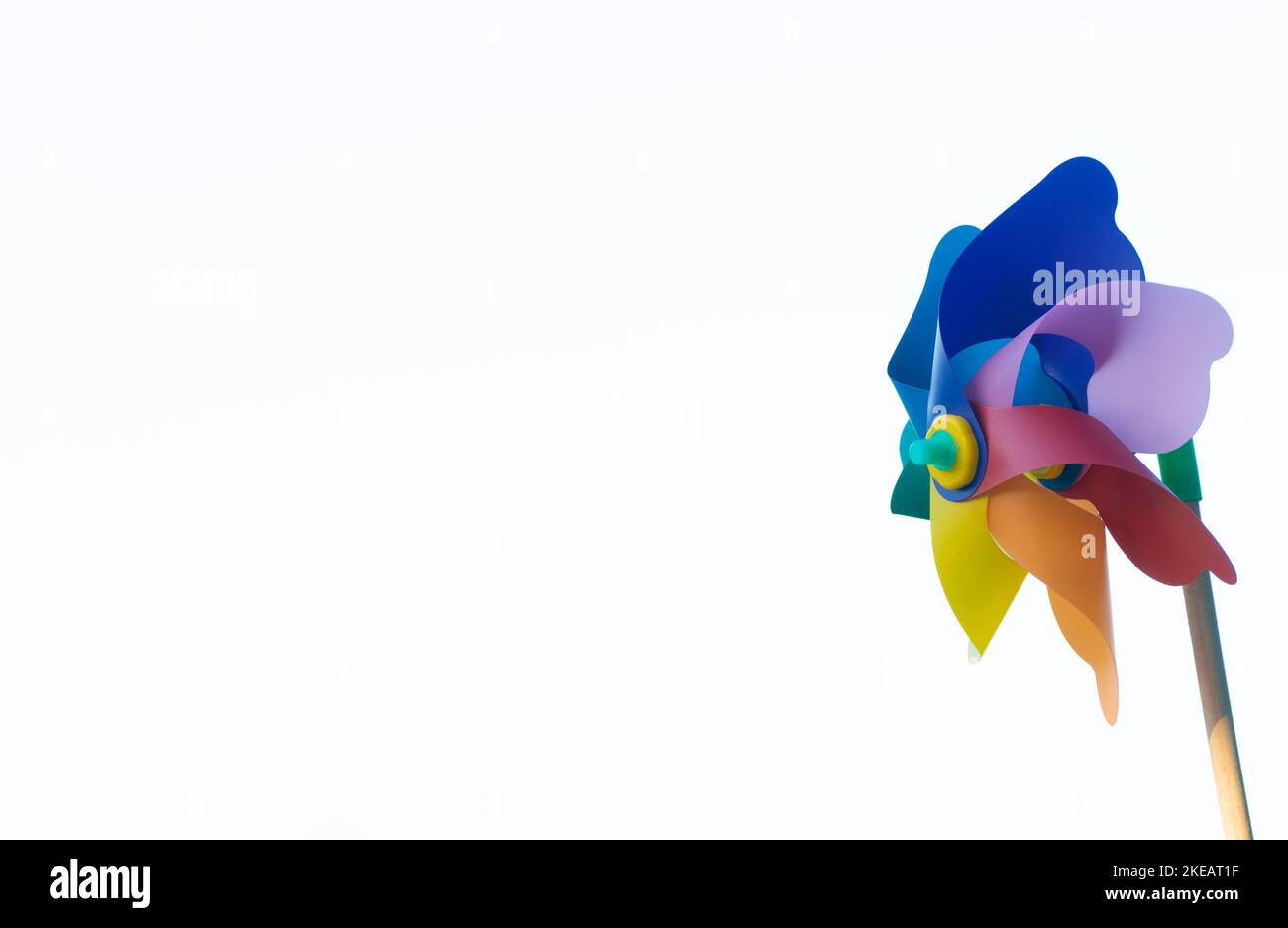 colorful wind wheel in the garden. Wind spinner decorative garden ...