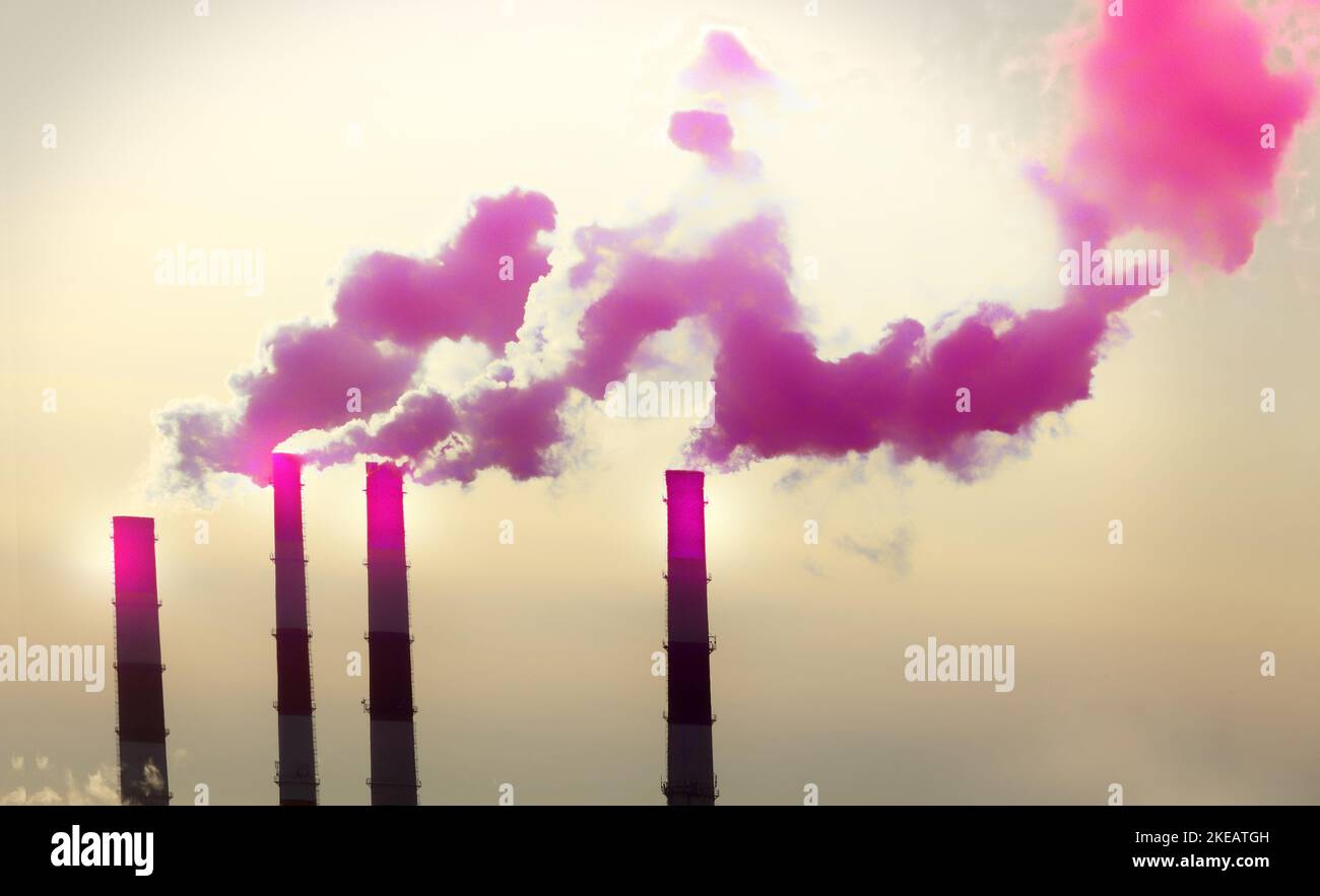 Spring, evening setting sun and smoking plant pipes. Dissonance of pure ...