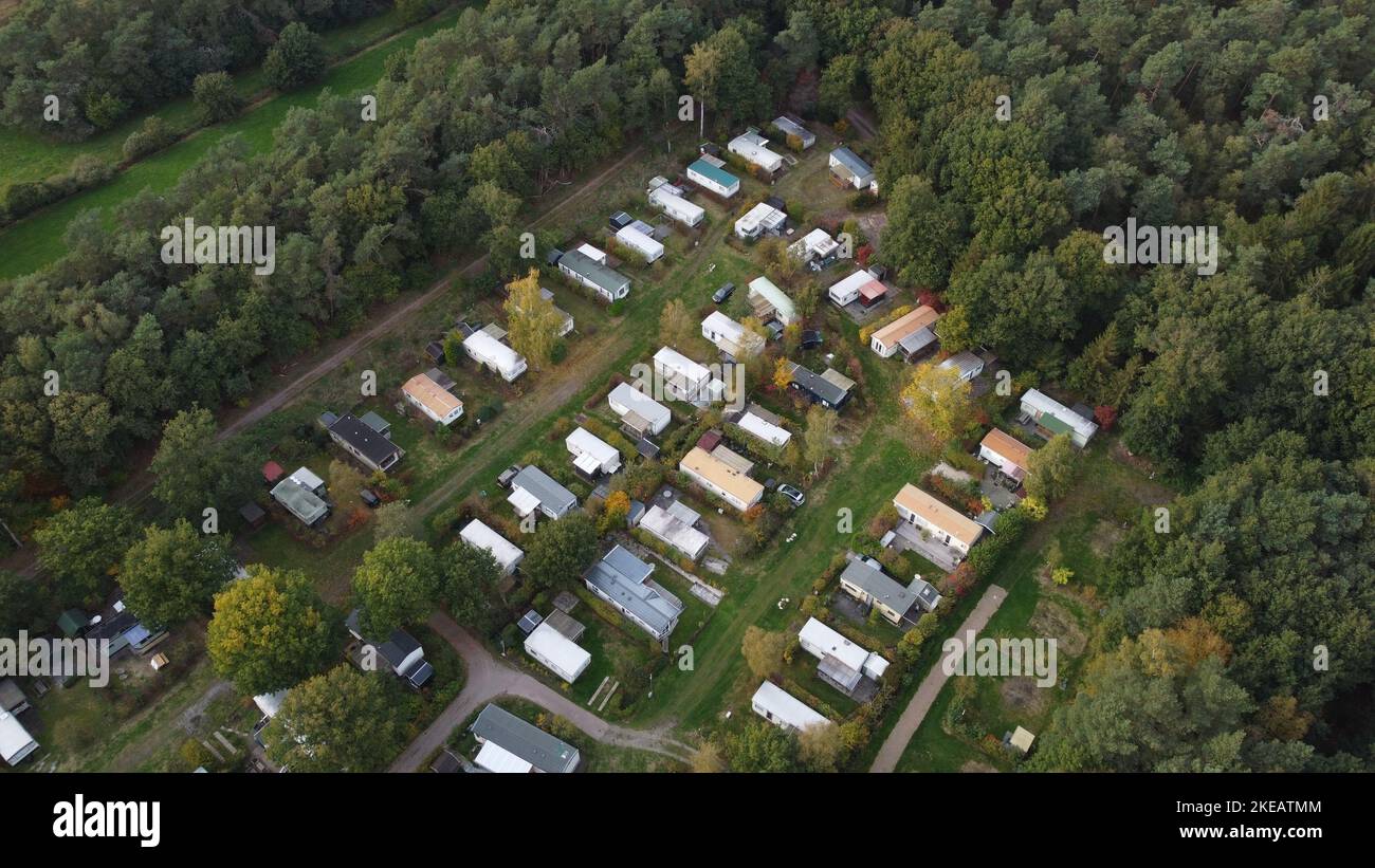Aerial view of campsite with mobile home caravans near a forest in The ...