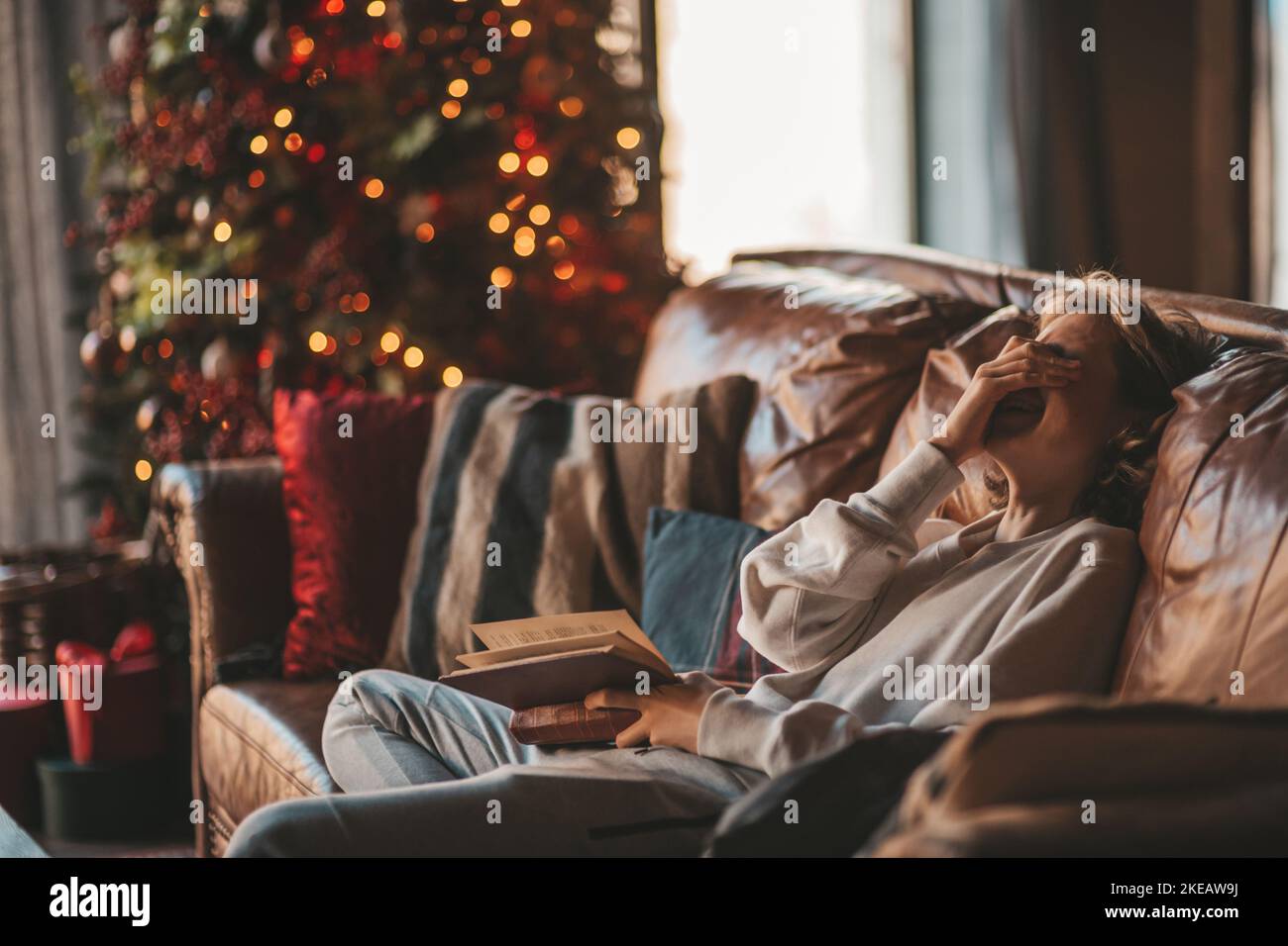 Young emotional cheerful teen boy with long hair laughter and joyful at ...
