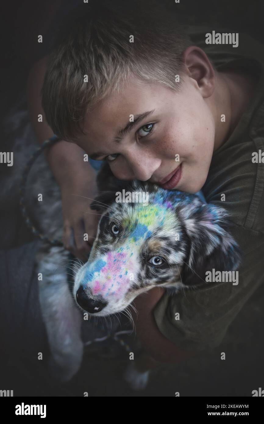 Boy with dog on lap hi-res stock photography and images - Alamy