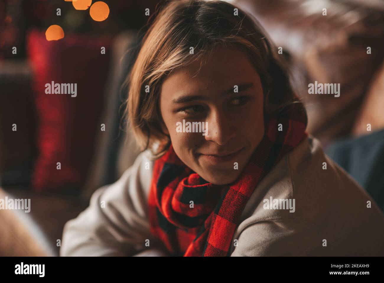 Young emotional cheerful teen boy with long hair laughter and joyful at ...