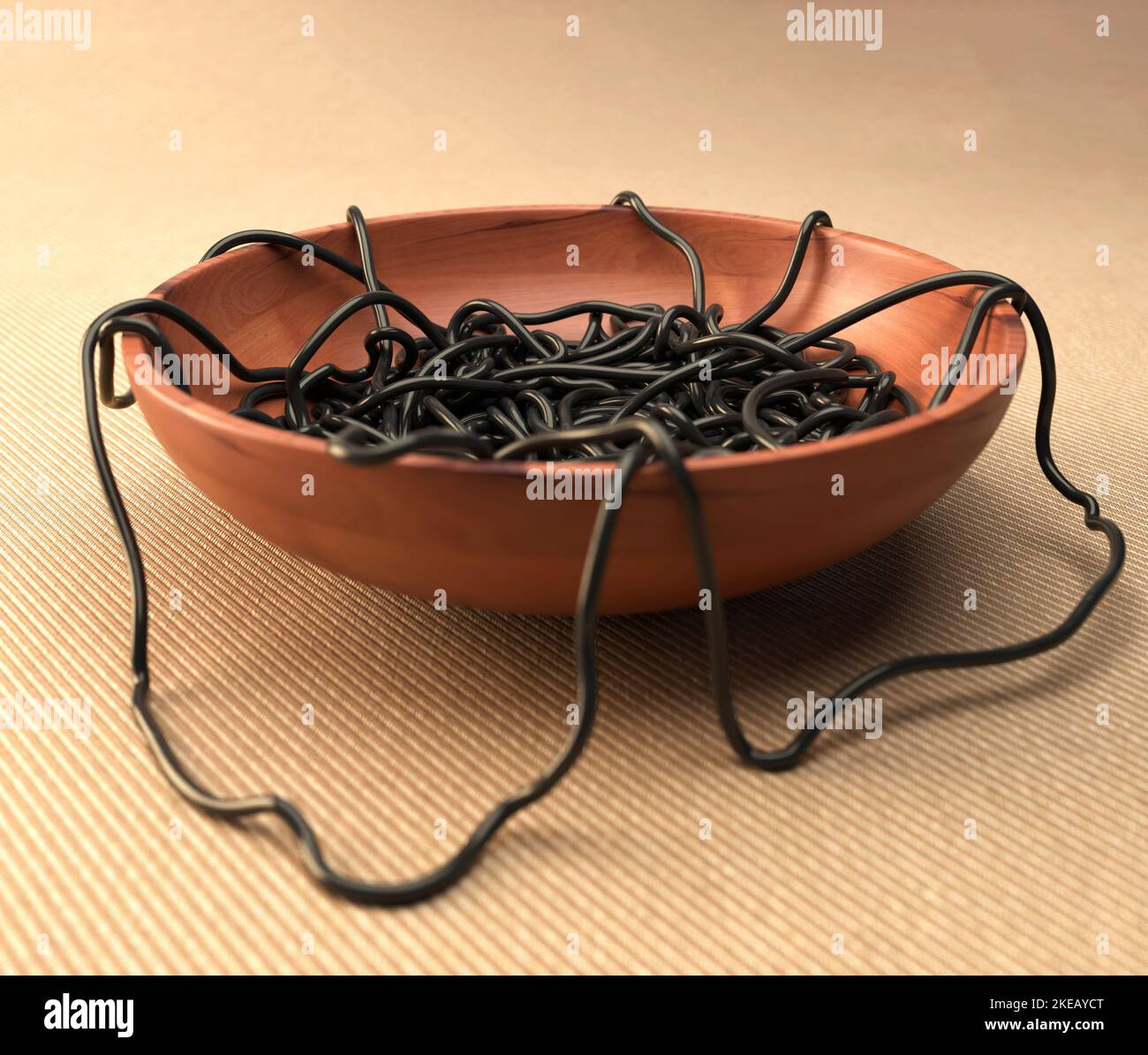 An untidy wooden bowl of black cuttlefish spaghetti on a warm cloth ...