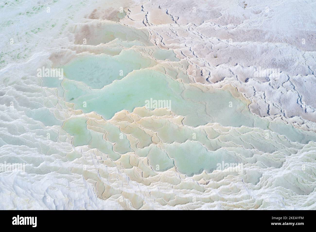 Turquoise water of thermal source in the white natural pools. Pamukkale ...