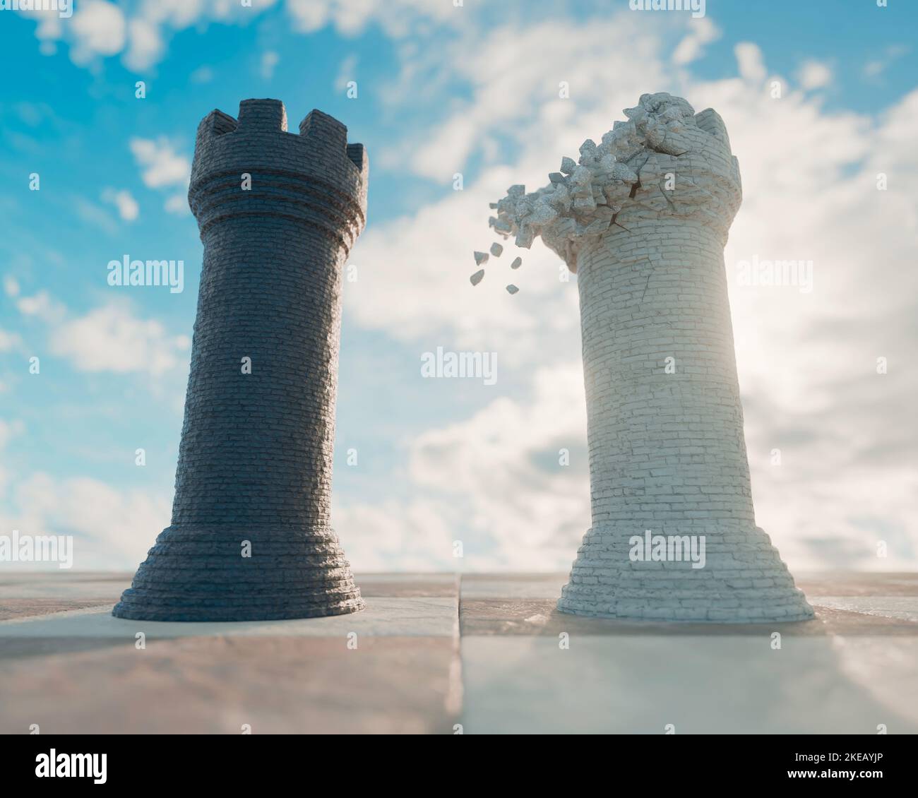 A black chess castle opposing a crumbling white castle on a chess board ...