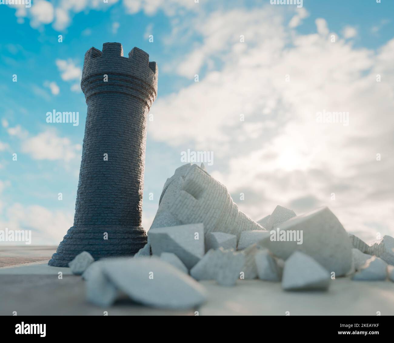 A black chess castle opposing a destroyed white castle on a chess board ...