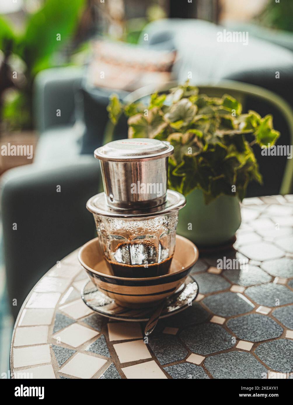 Vietnamese coffee with condensed milk in glass cups and traditional ...