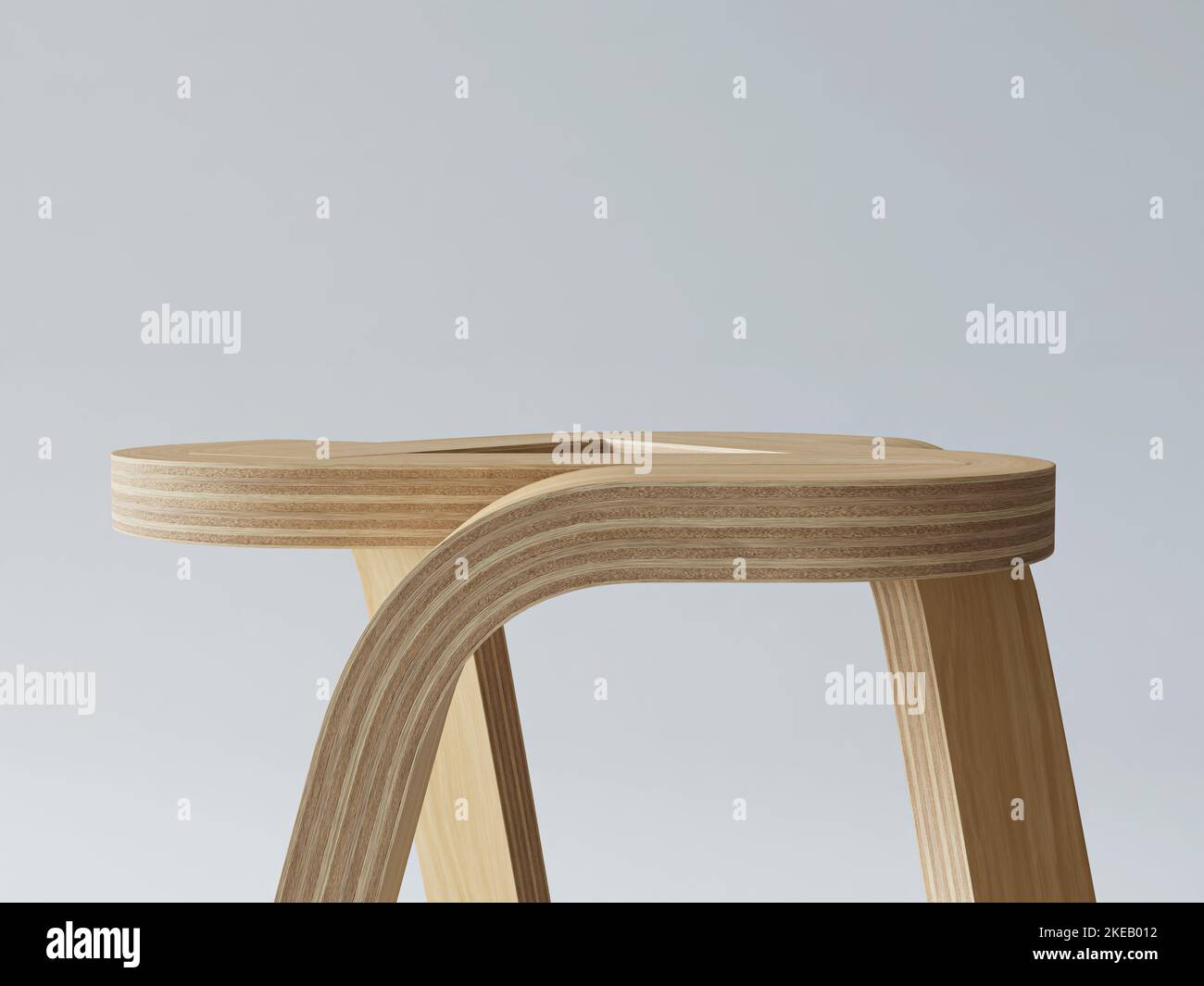 A wooden side table made from three curvy interlocking parts on an ...