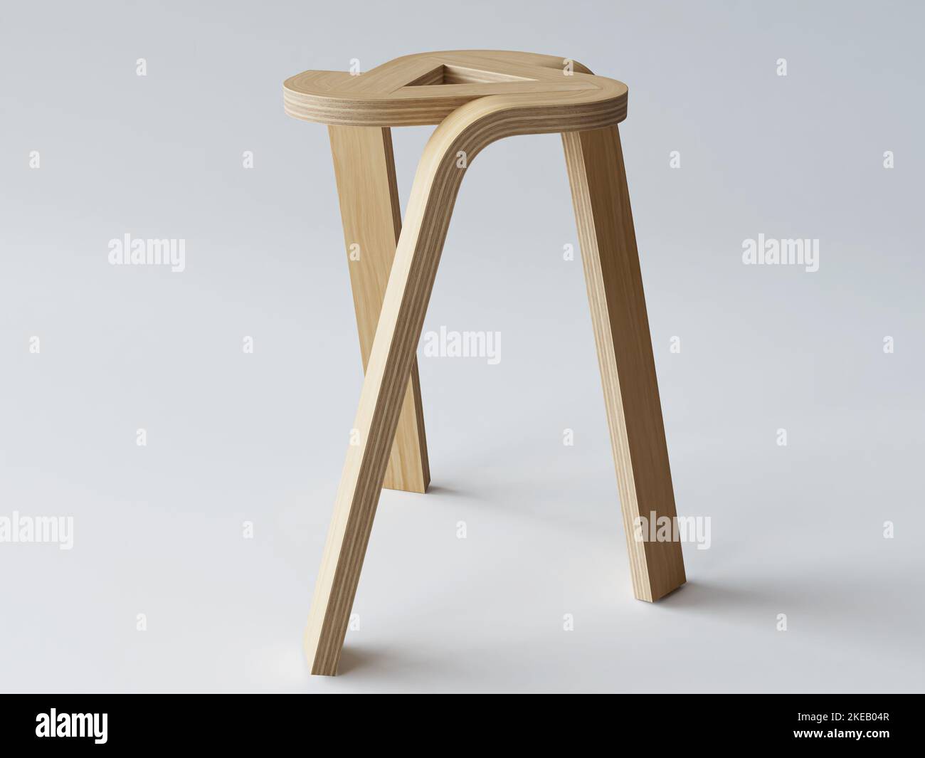 A wooden side table made from three curvy interlocking parts on an ...