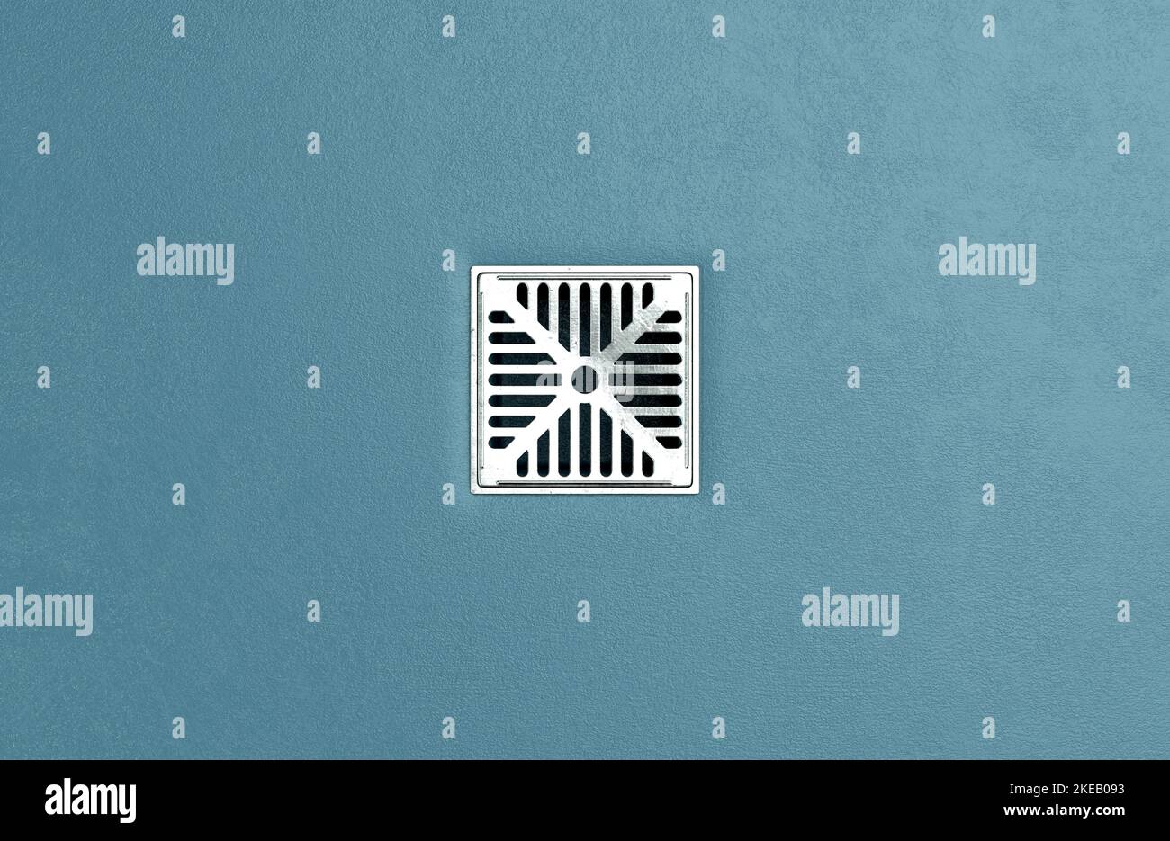 A closeup of a square chrome drain set in on a blue floor surface - 3D ...