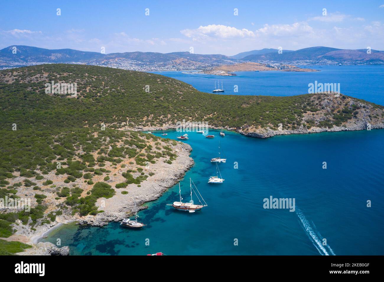 Aerial view of blue sea lagoon and yachts along the mediterranean coast ...