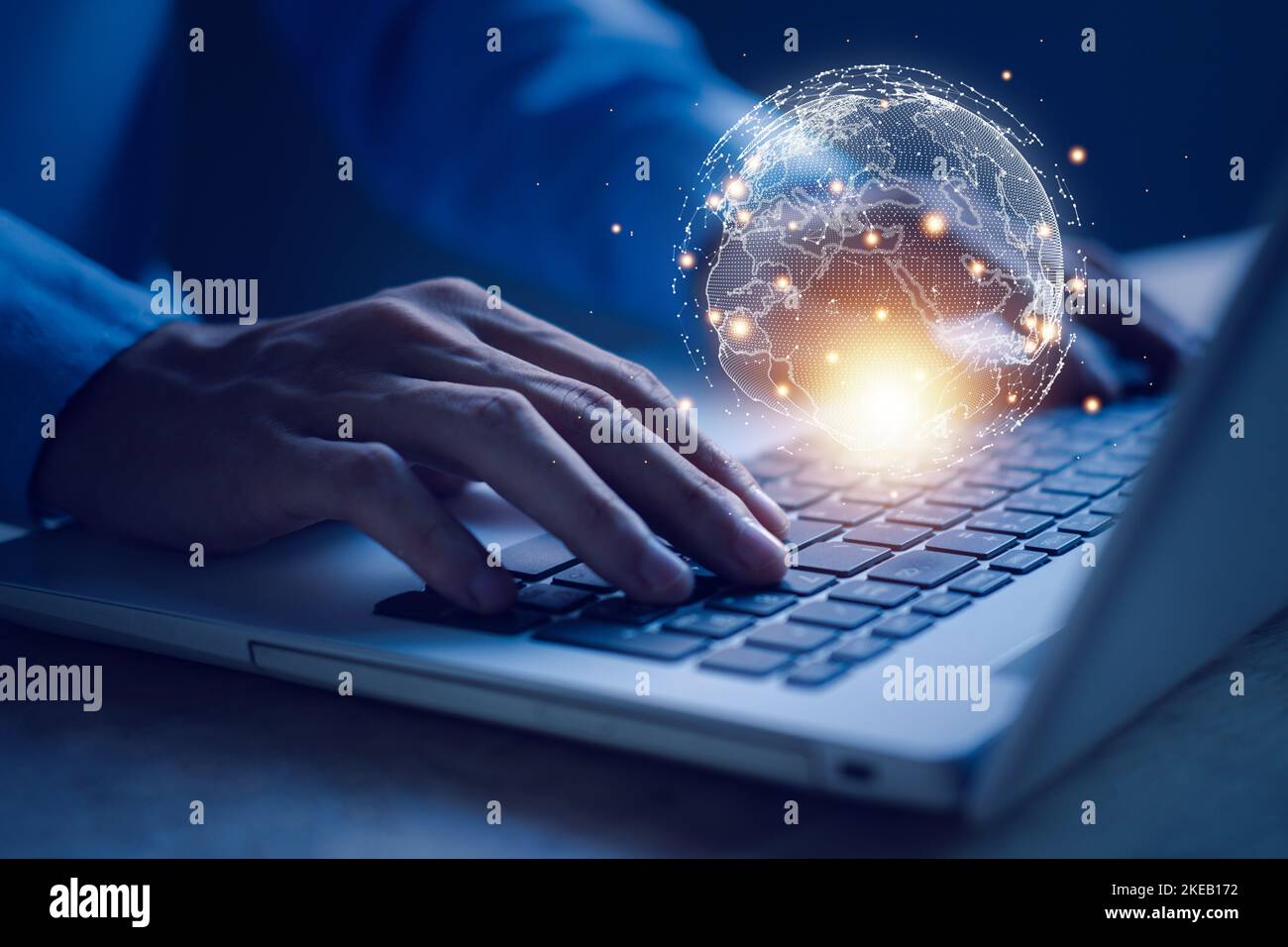 Businessman hands typing notebook (Laptop) with virtual global hologram ...