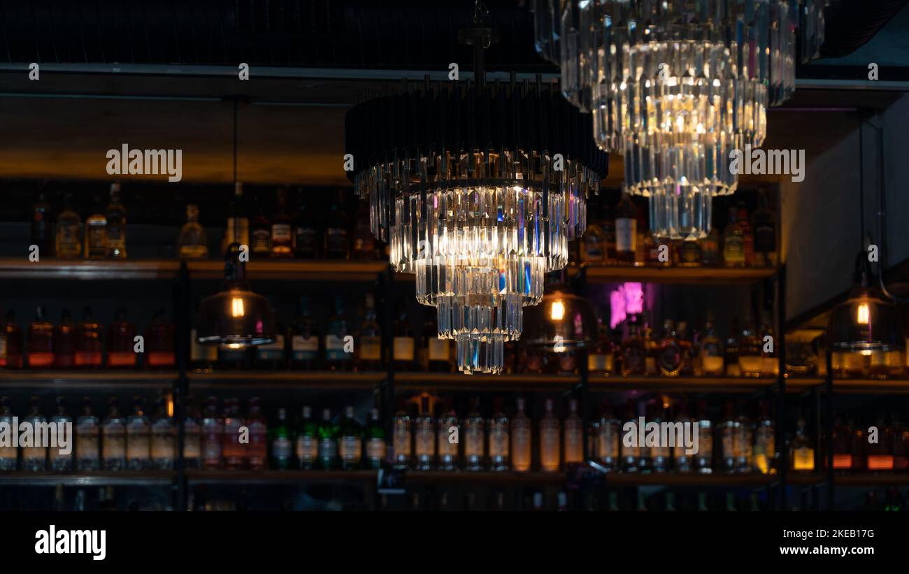Interior view of a night club. Inside of a bar with ligths and alcohol ...