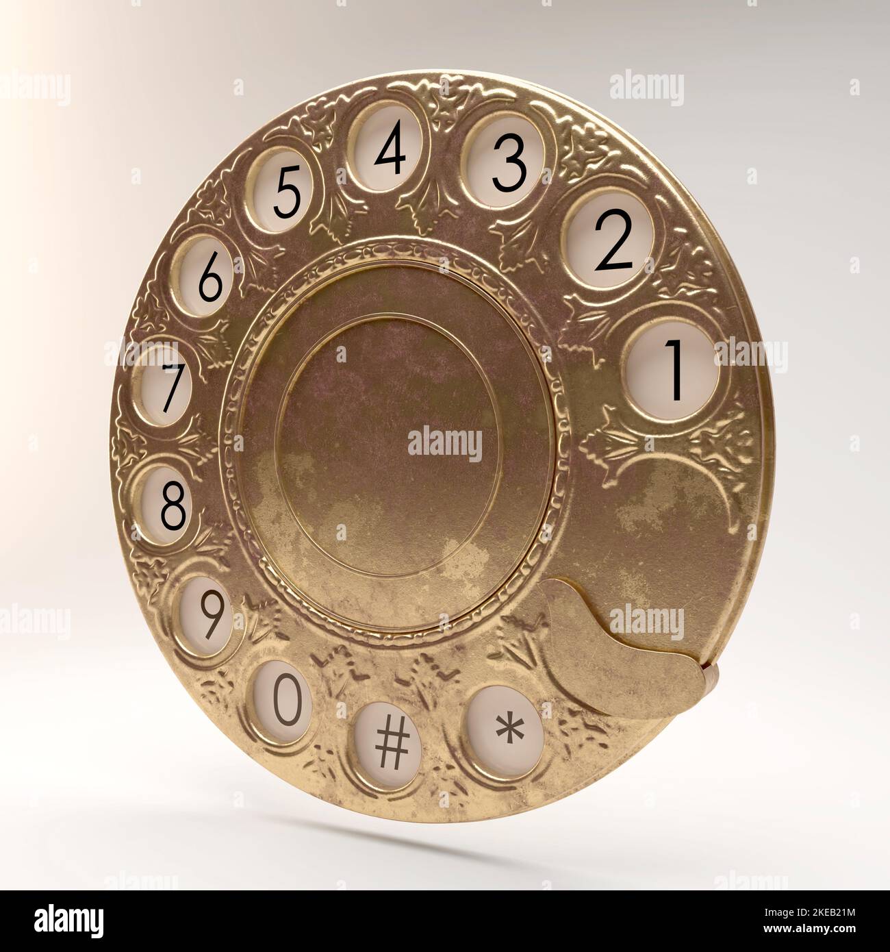 A vintage brass rotary telephone dial with classic embellishments on an ...