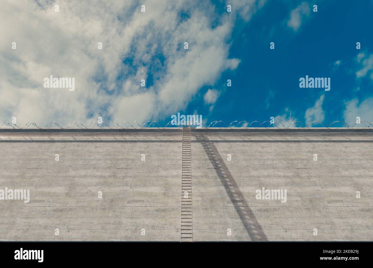 A high concrete wall topped with barbed wire with a long metal step ...