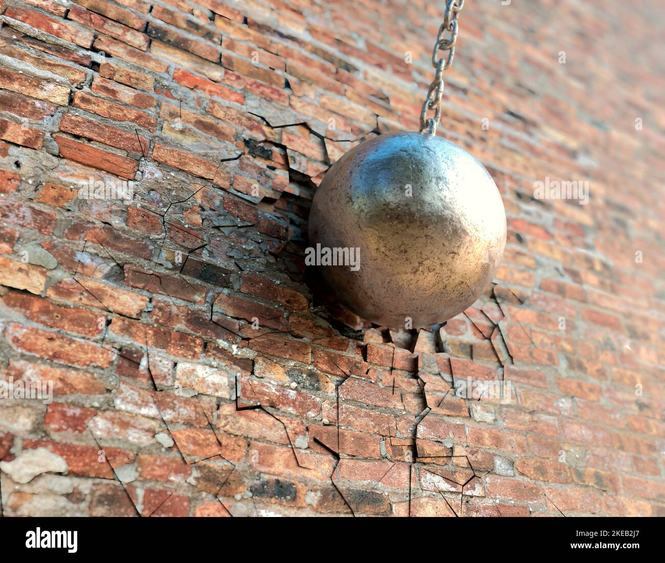 A regular metal wrecking ball attached to a chain breaking a hole in a ...