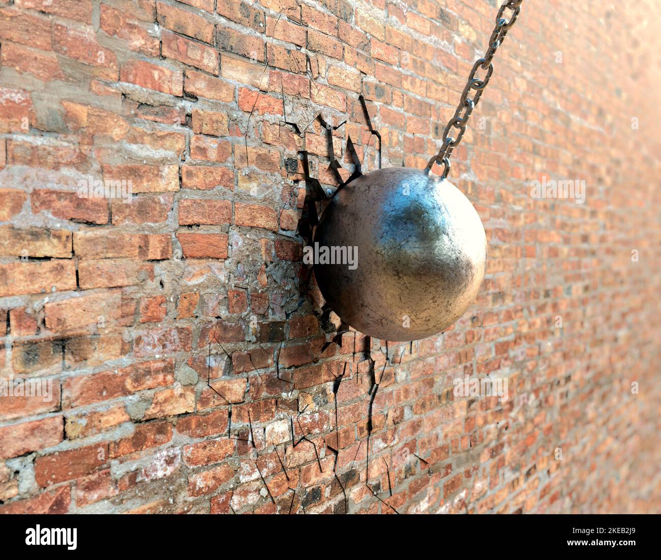 A regular metal wrecking ball attached to a chain breaking a hole in a ...