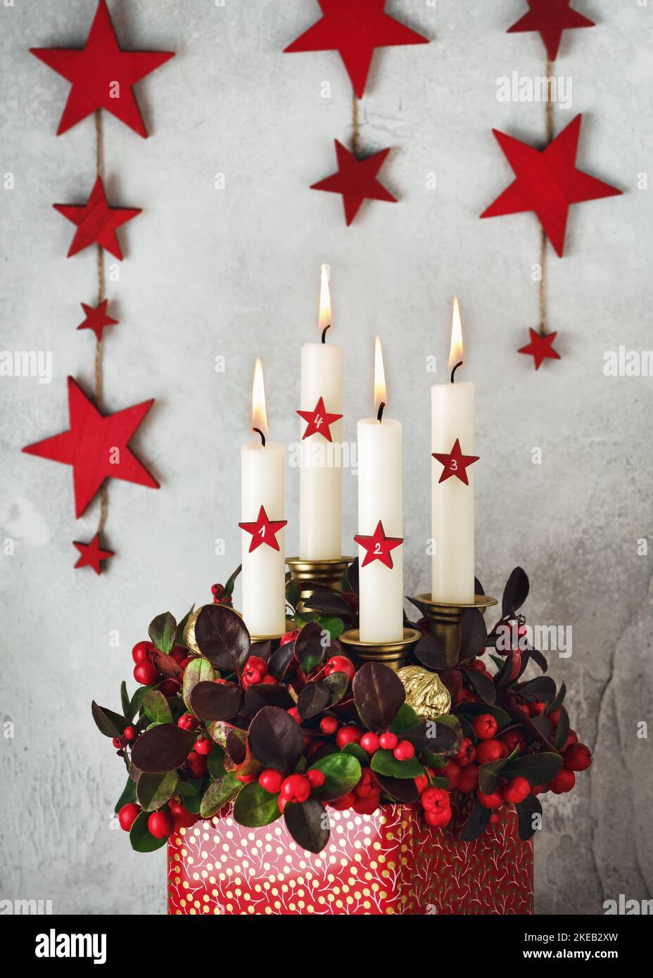 Beautiful Advent floristic arrangement. Red checkerberry plant with ...