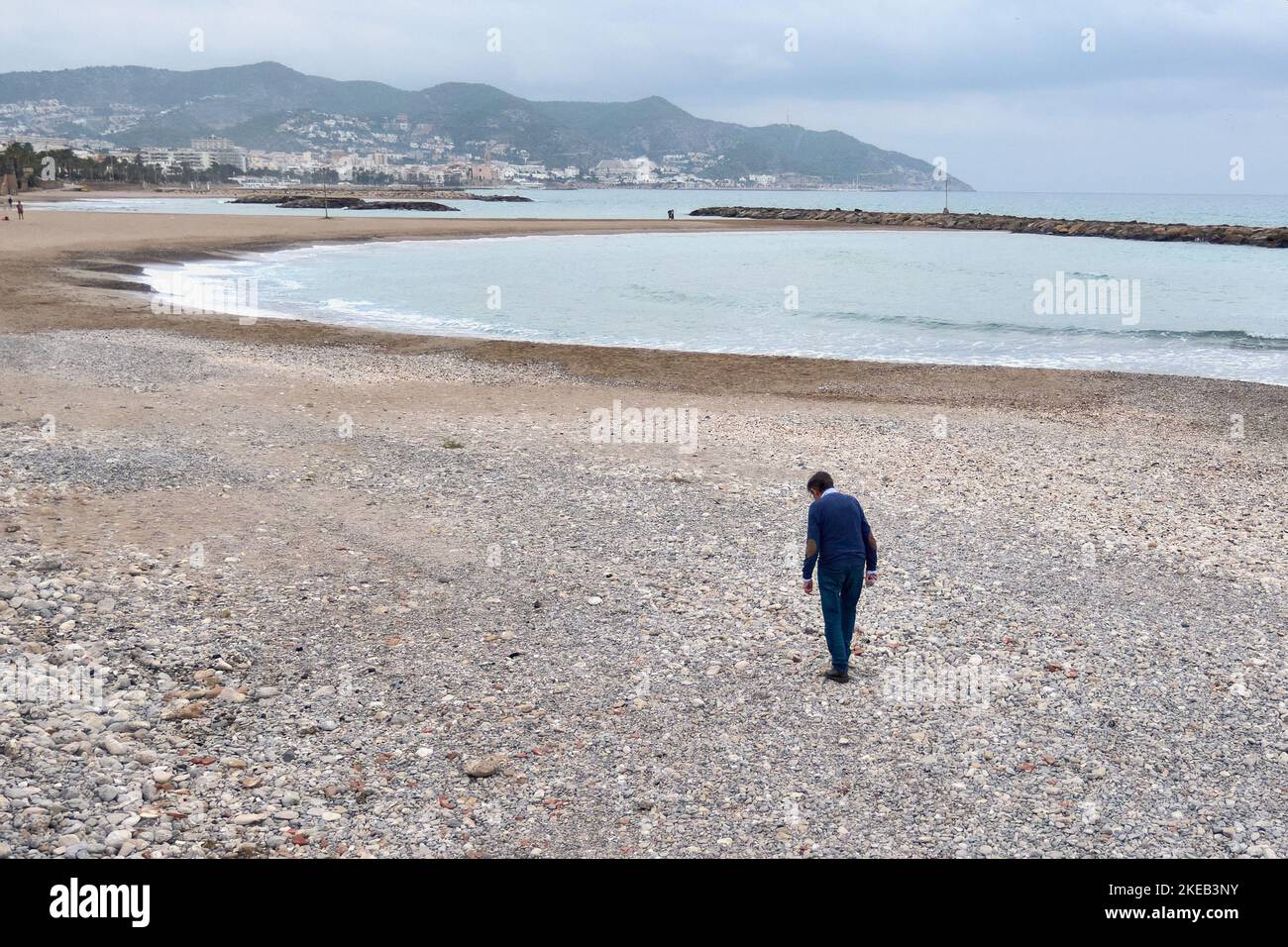 Depressed and lonely man dressed on an empty beach Stock Photo - Alamy