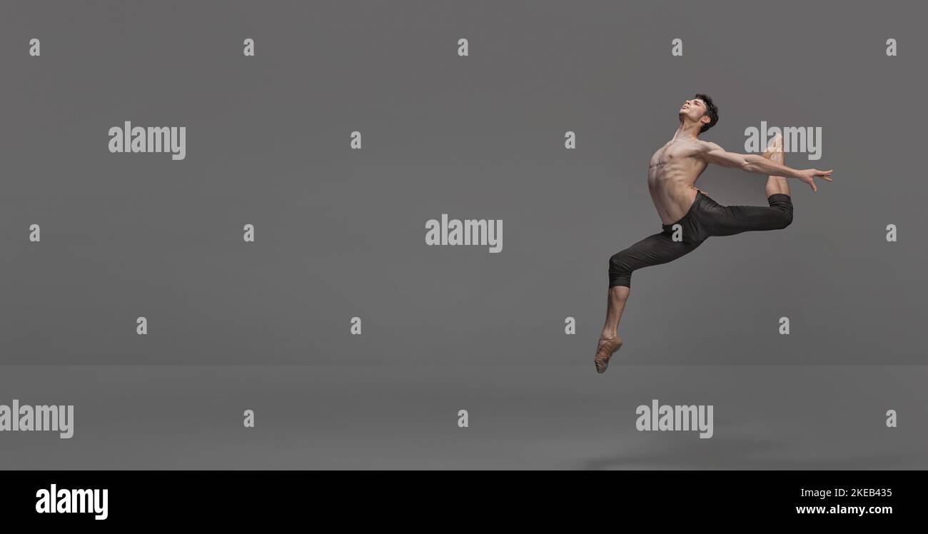 Portrait of young muscular man, ballet dancer performing on stage ...