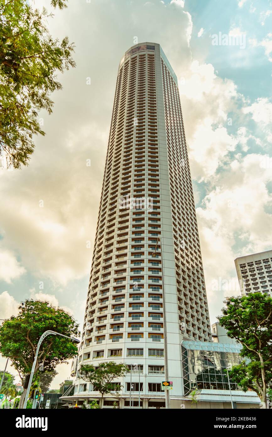 A vertical shot of the Swissotel building before the sunset in ...