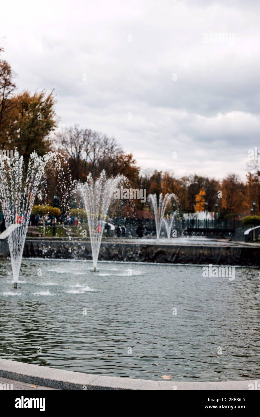 Ukrainian autumn landscape with fountains and trees. Big beautiful city ...