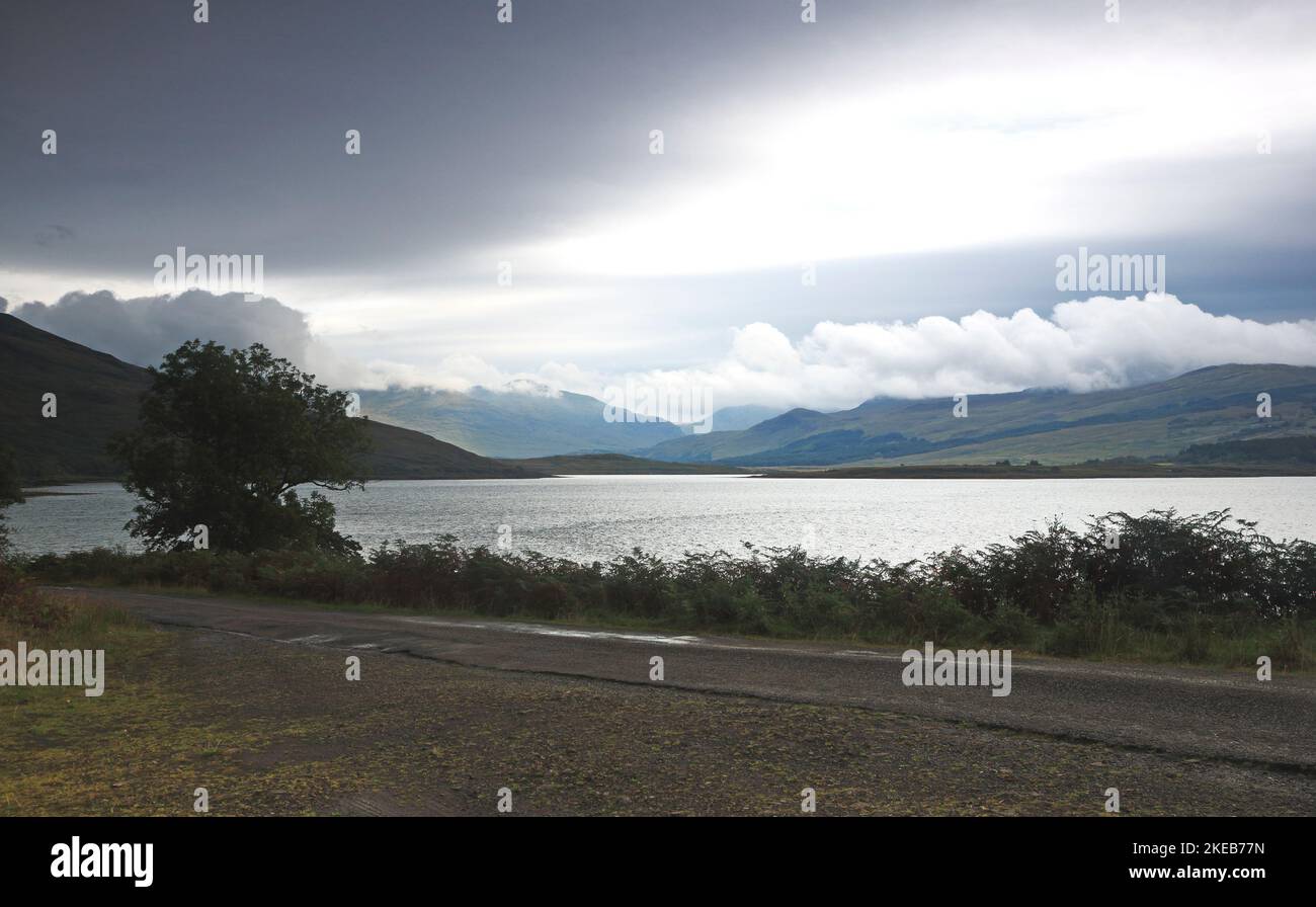 A view from the B8035 road across Loch Scridain and Loch Beg to low ...