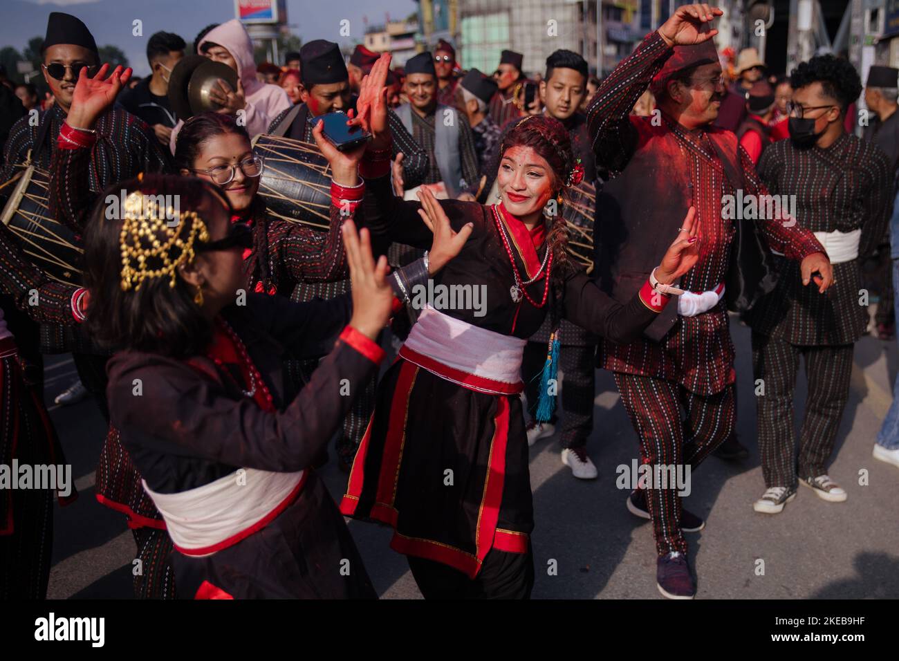 Nepalese women dressed in traditional Newari attire perform a dance as ...